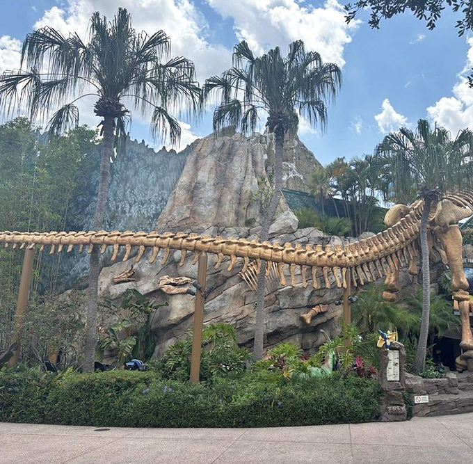Palm trees frame the impressive exterior bone structure, creating that perfect "Welcome to Jurassic Florida" first impression.
