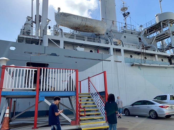 The portside boarding area welcomes visitors to step back in time and experience authentic maritime history firsthand.