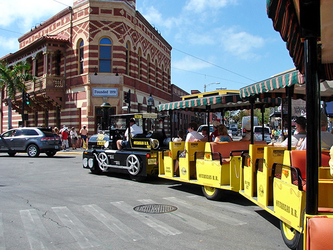 Historic architecture frames the perfect shot as the Conch Train rolls past buildings that have witnessed centuries of island life.