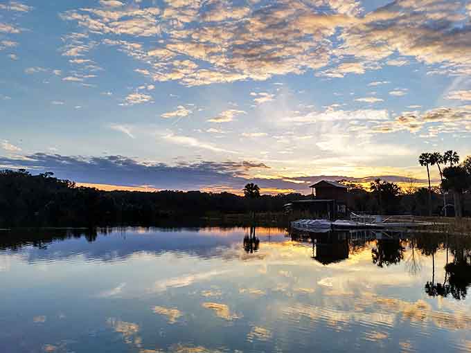 As day surrenders to evening, Hanna Park's lake becomes a mirror for the sky's most spectacular color show.
