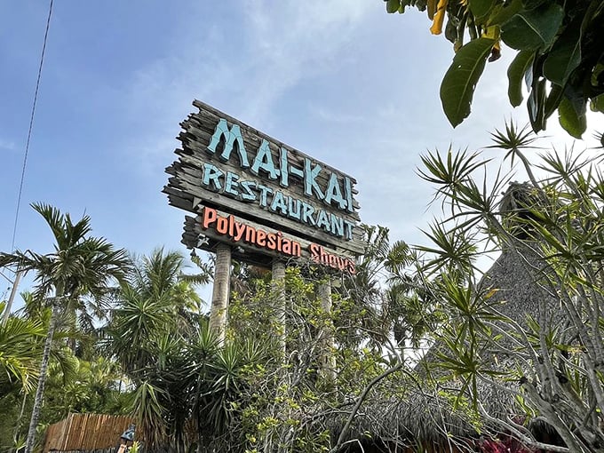 The Mai-Kai sign rises above a jungle of palms like a beacon calling to all who appreciate kitsch, strong drinks, and fire dancers under the Florida sky.