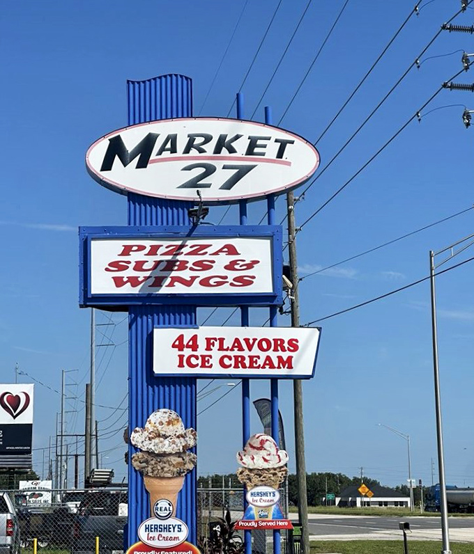The iconic Market 27 sign stands tall against the Florida sky, a beacon of hope for hungry travelers seeking comfort food paradise.