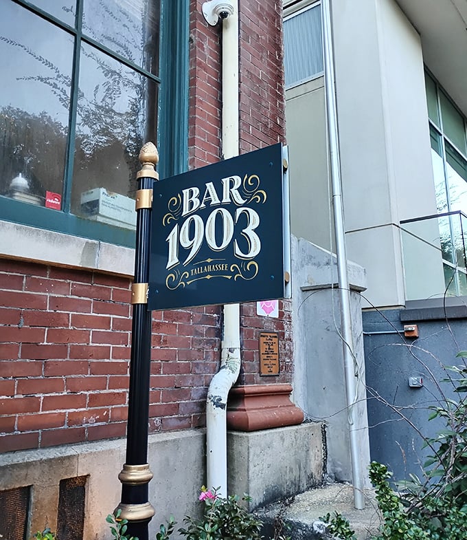 Gateway to another era: The elegant Bar 1903 sign marks the entrance to a place where time slows down and every detail matters.