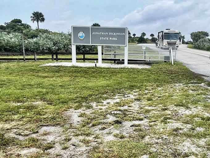 The entrance sign stands as both welcome and promise – beyond this point lies adventure, serenity, and a Florida that time forgot.