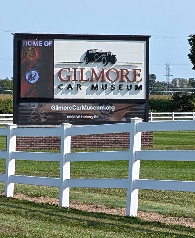 The welcoming sign promises automotive adventures beyond&mdash;this roadside marker is just the beginning of a journey through motoring history.