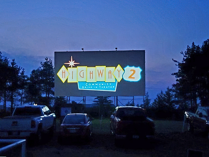 Highway 2's vintage-inspired logo glows against the twilight sky, a beacon calling cinema lovers to gather beneath the stars.