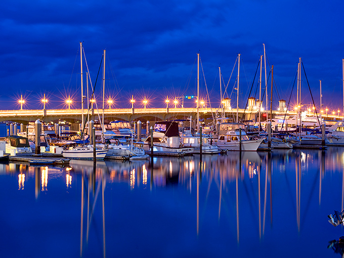 St. Augustine's marina glows with evening magic, the boats gently bobbing as day transitions to night in America's oldest city.