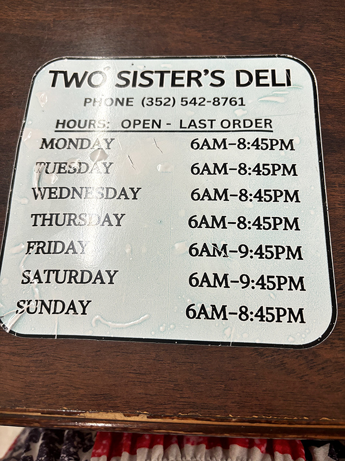 The hours posted on this well-worn sign tell you everything &ndash; this place opens at dawn and serves until evening, a testament to dedication.