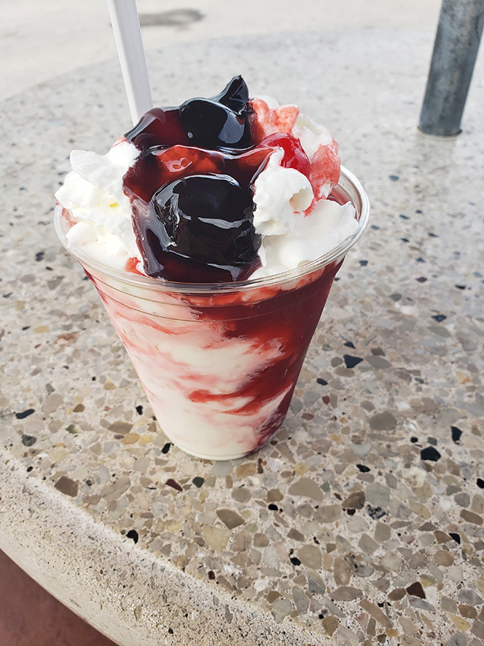 A strawberry sundae that's practically wearing jewelry &ndash; ruby-red sauce, pearl-like whipped cream, and golden nut accents create an edible treasure that's almost too pretty to eat. Almost.