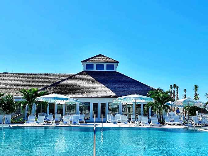 The Gasparilla Inn's pool area promises the perfect afternoon &ndash; crystal blue waters surrounded by palm trees and attentive service.