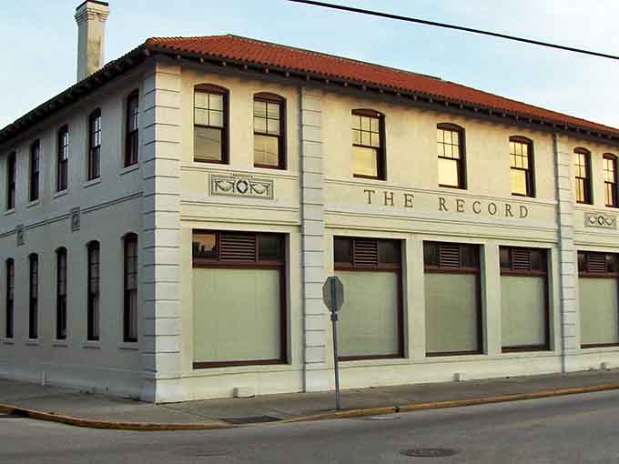 The Record building stands as a monument to local journalism, where community stories found their voice long before social media existed.
