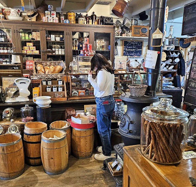 Customers discover treasures among wooden barrels and vintage displays, where shopping becomes a journey through America's commercial heritage.