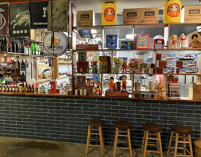 Bright signs and quirky collectibles greet guests with cheerful, Tokyo-inspired charm while they wait.