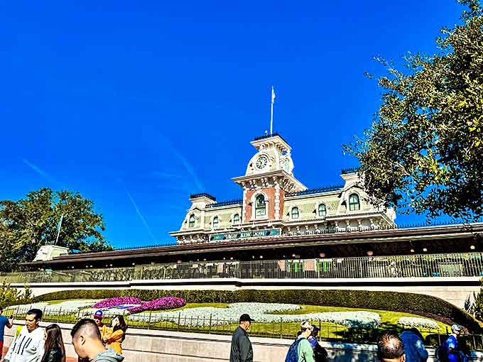 Blue skies provide the perfect backdrop for the Main Street Station's Victorian architecture, welcoming visitors to begin their magical journey.