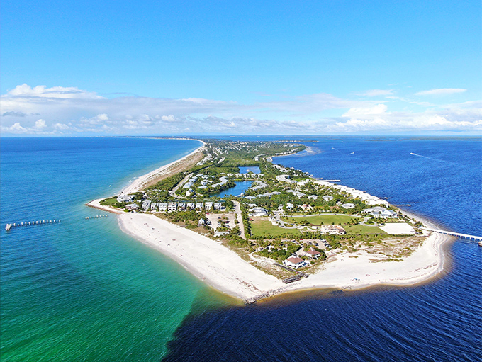 Gasparilla Island reveals its perfect hourglass shape from above, a slender paradise embraced by Gulf waters and protected from time itself.