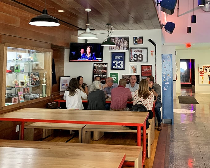 Patrons gather around communal tables, sharing not just meals but the collective joy of '90s nostalgia.
