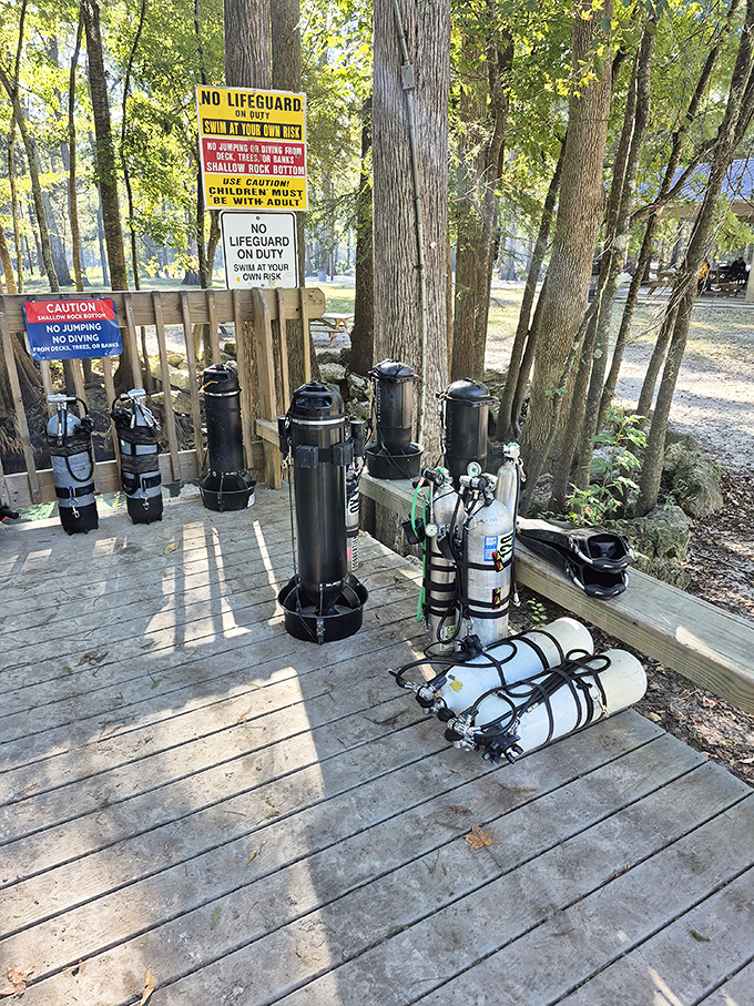 Diving gear standing ready like sentinels, guarding the gateway to underwater adventures that await below.