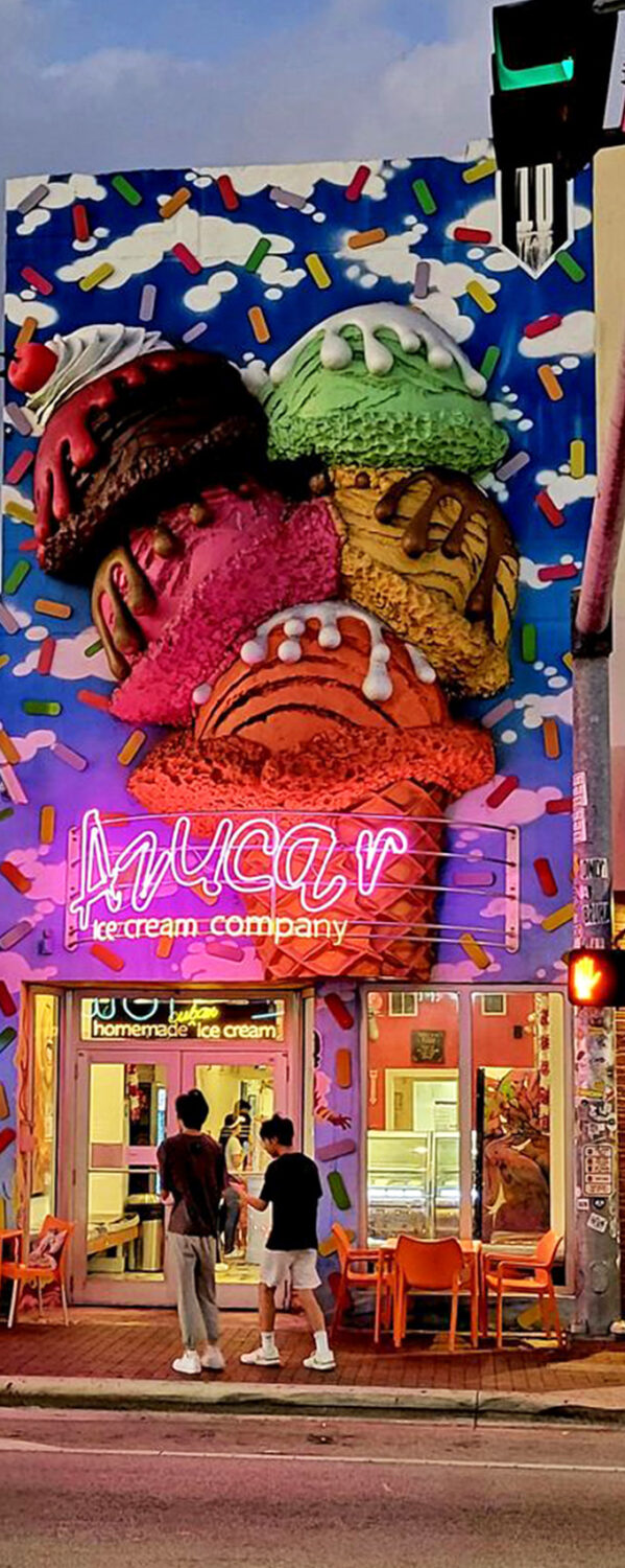 As night falls, Azucar's neon sign glows like a beacon for dessert pilgrims, promising sweet relief from Miami's endless summer.