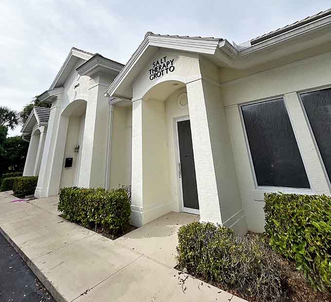 The striking exterior view showcases the bathhouse's unique design, a concrete and wood testament to early Florida tourism.