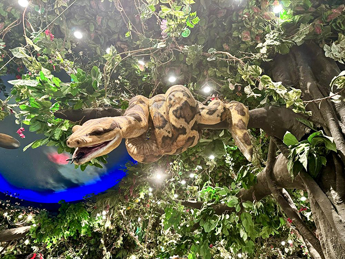 A massive python coils through the artificial canopy &ndash; thankfully more interested in being part of the decor than joining you for dinner.