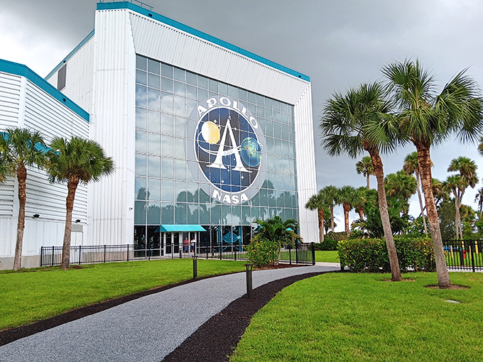 The Apollo/Saturn V Center's exterior might look unassuming, but inside waits a cathedral to human ingenuity that makes even Disney's imagineers jealous.