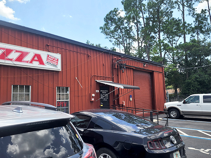 The parking area outside Angelotti's, where classic cars and hungry patrons gather before embarking on their culinary adventure.