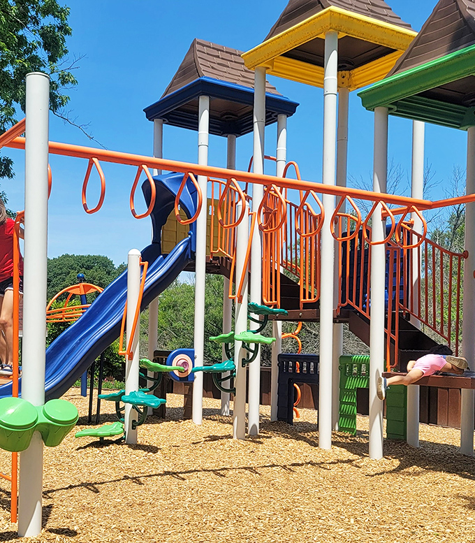 Playground: Colorful equipment offers young visitors a chance to burn energy while parents enjoy the surrounding garden beauty.
