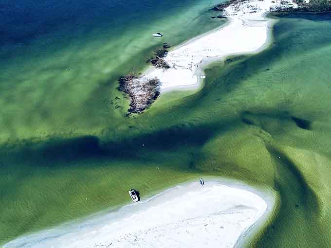 These sandbars emerge at low tide like secret islands, perfect for pretending you've discovered uncharted territory even though people definitely know about them.
