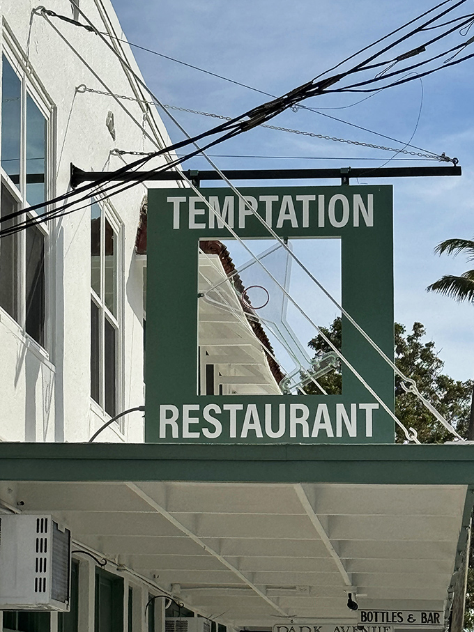 The iconic green Temptation sign has guided hungry visitors for generations. This landmark promises exceptional seafood to those in the know.