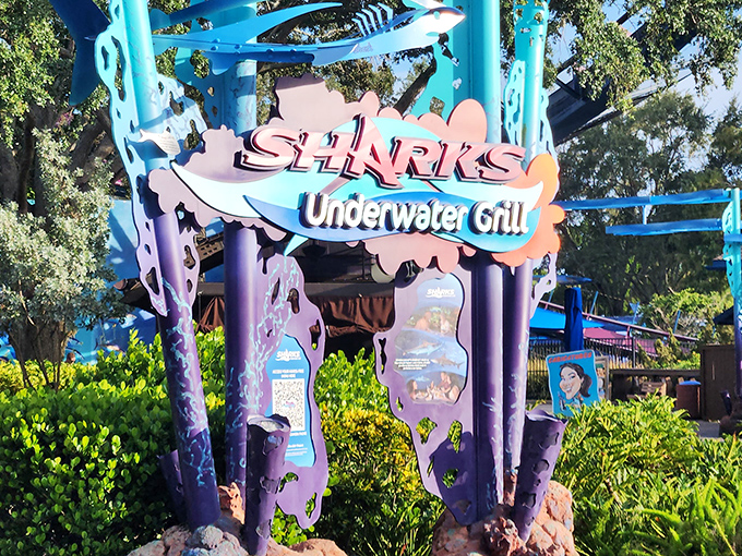 The restaurant's entrance sign promises an extraordinary dining adventure where the line between observer and observed blurs with every bite.