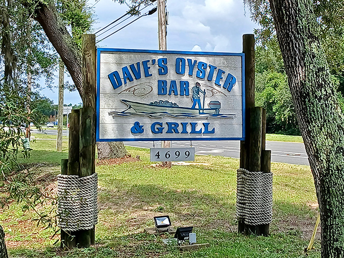 Blue letters against weathered wood announce this seafood sanctuary to those lucky enough to find it &ndash; a beacon for hungry travelers.