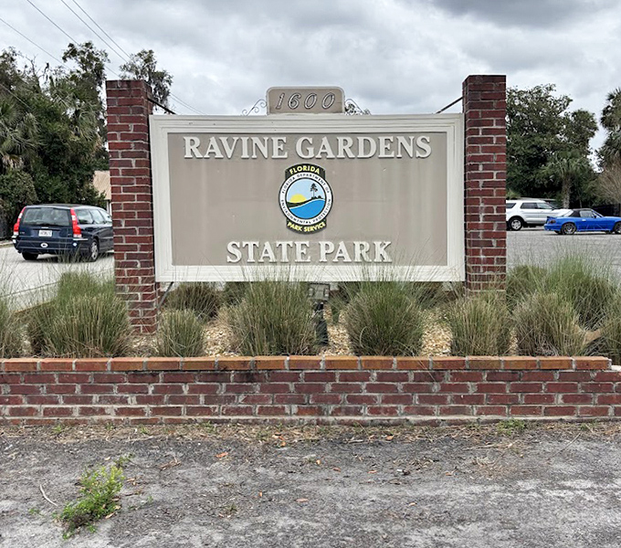 Ravine Gardens' entrance sign: where ordinary expectations go to die and extraordinary memories come to life.