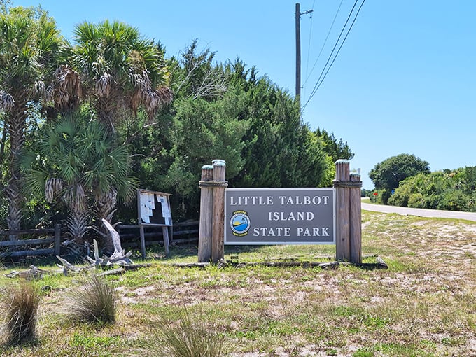 The welcoming sign promises adventure beyond, a wooden gateway to one of Florida's last wild barrier islands &ndash; paradise without pretense.