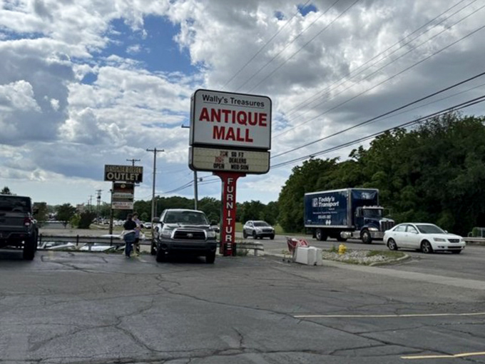The roadside beacon that guides nostalgia seekers to their mecca &ndash; Wally's sign promises treasures for those who enter.