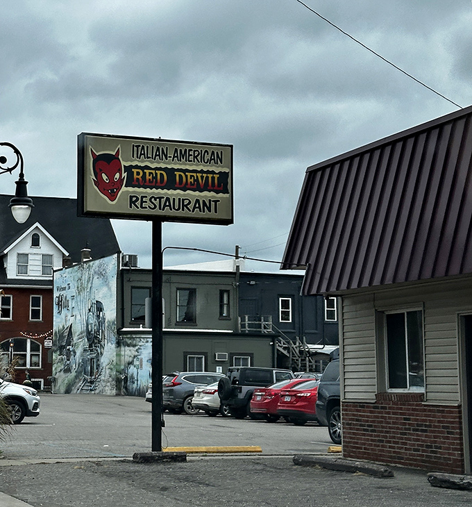 The roadside sign featuring that mischievous devil mascot gives the first hint that culinary magic awaits inside this unassuming building.