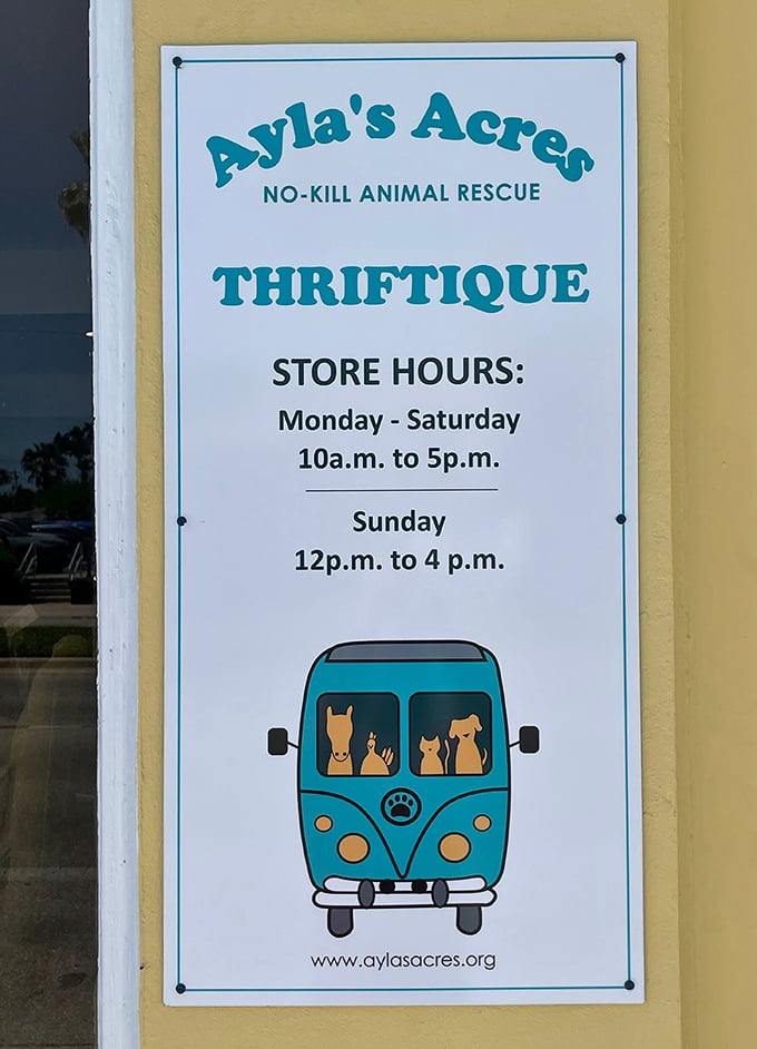Store hours posted clearly on the door, with the adorable rescue van illustration reminding shoppers exactly where their dollars are going.