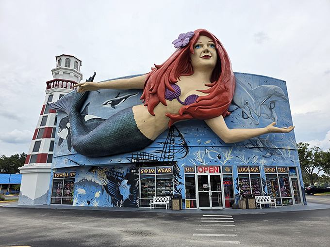 The iconic storefront: The famous mermaid, now with flowing red locks, stretches her arms wide as if to say, "Come in, your wallet won't know what hit it!"