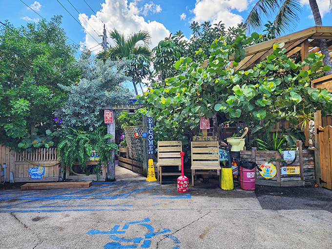 Le Tub's entrance feels like discovering a secret garden hideaway, with colorful recycled items creating a quirky welcome.