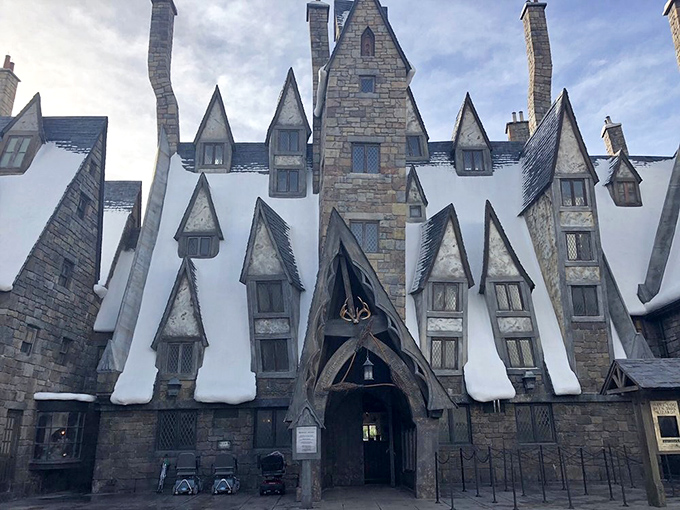 The crooked chimneys and snow-dusted rooftops of Three Broomsticks transport you straight to a wizarding village. Every architectural detail feels plucked from a magical storybook.