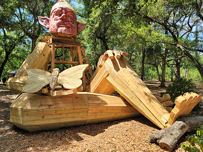 This relaxing wooden gnome at Folly Farms seems to be soaking up Florida sunshine, complete with giant feet and detailed craftsmanship.