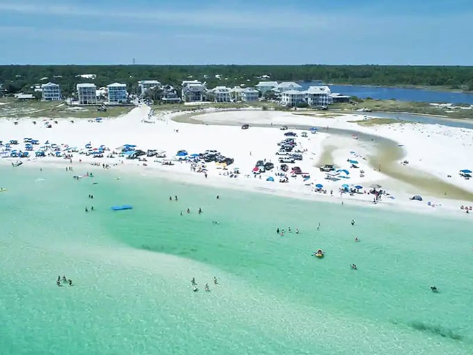 Western Lake creates a magical meeting point where fresh and salt water mingle, surrounded by natural dunes and happy beachgoers.