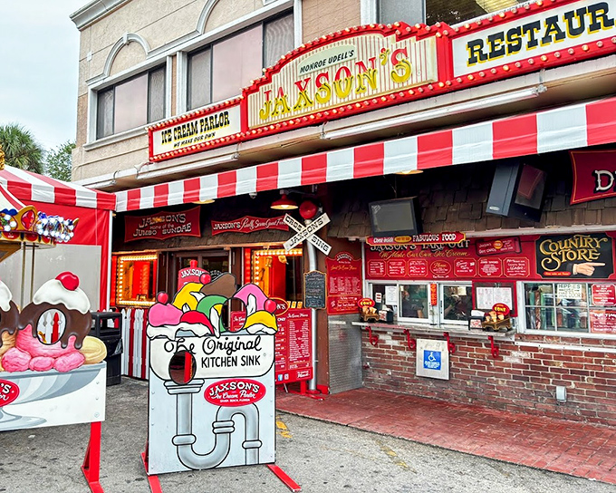 The famous "Kitchen Sink" sign promises dessert adventures that require both a spoon and a strategy.