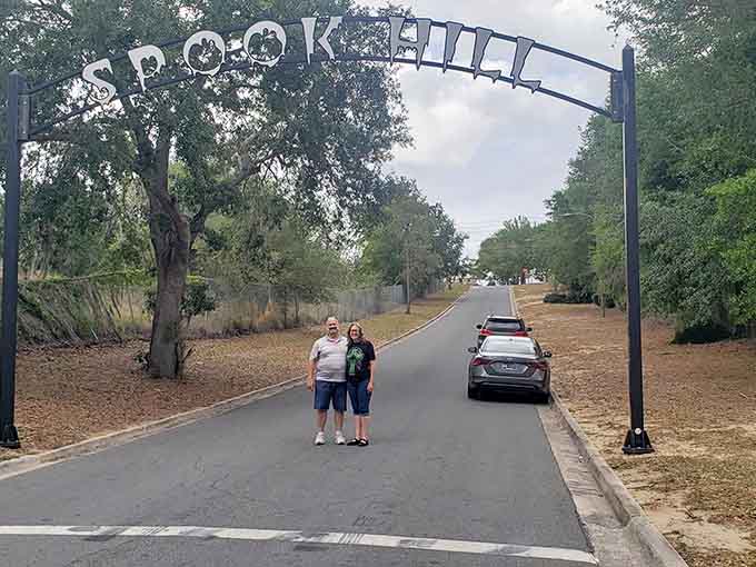 Nothing says "family road trip" quite like standing in the middle of a street where gravity forgot how to work properly.