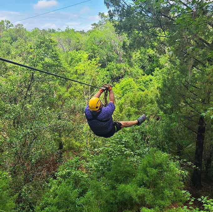 Flying through oak canopies with rocky cliffs below proves you don't need mountains for epic zipline views.
