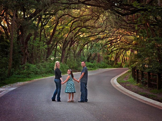 Family moment frozen in time: the tree tunnel provides a perfect backdrop for creating memories that will last generations.