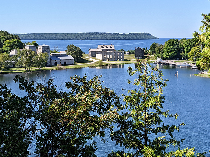 The panoramic view showcases Fayette's perfect marriage of natural beauty and historical significance along Lake Michigan's pristine shoreline.