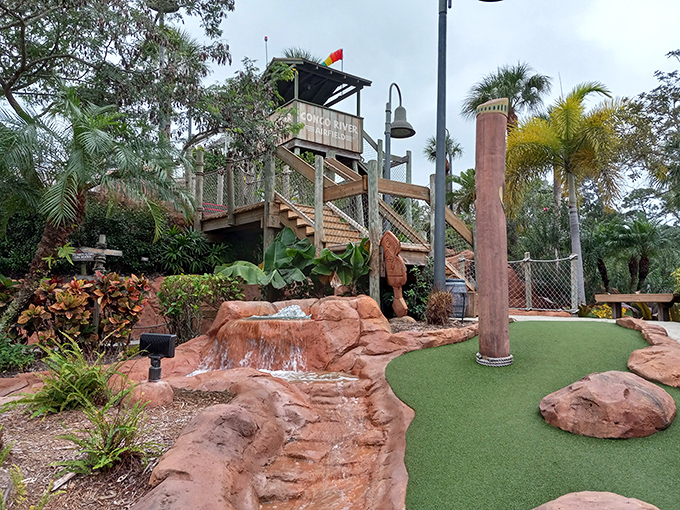 The observation tower beckons explorers to climb higher, offering panoramic views of the mini-golf safari below.