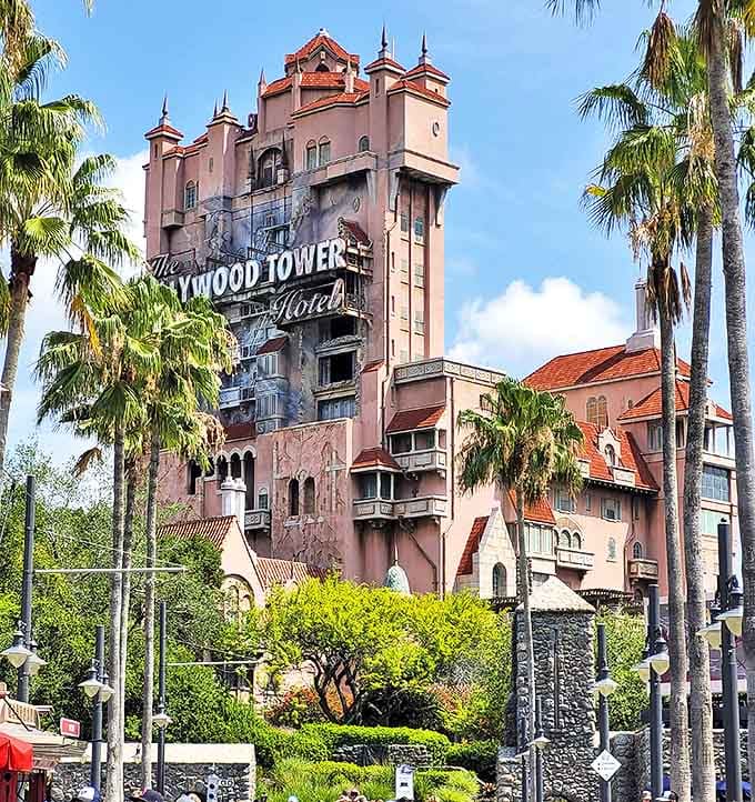 The Hollywood Tower Hotel stands tall and ominous, its faded pink facade hiding thirteen floors of delightfully terrifying drops and ghostly encounters.