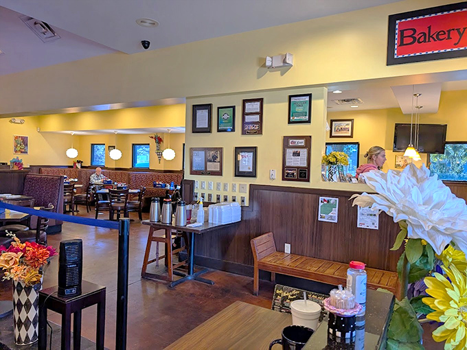 Warm yellow walls and cozy wooden booths create that "everybody knows your name" atmosphere that keeps locals coming back.