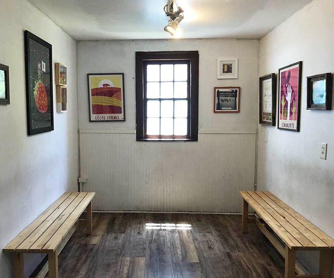 Simple wooden benches and art-adorned walls create an unpretentious gallery space where the real masterpieces are waiting in the freezer.